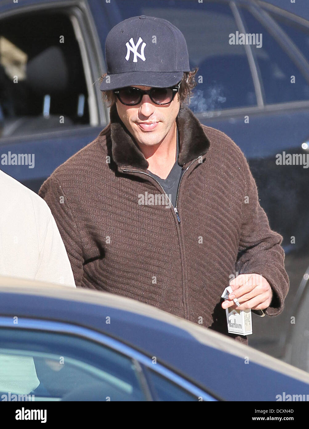 Brandon Davis smoking a cigarette as he shops at Barney's of New York ...