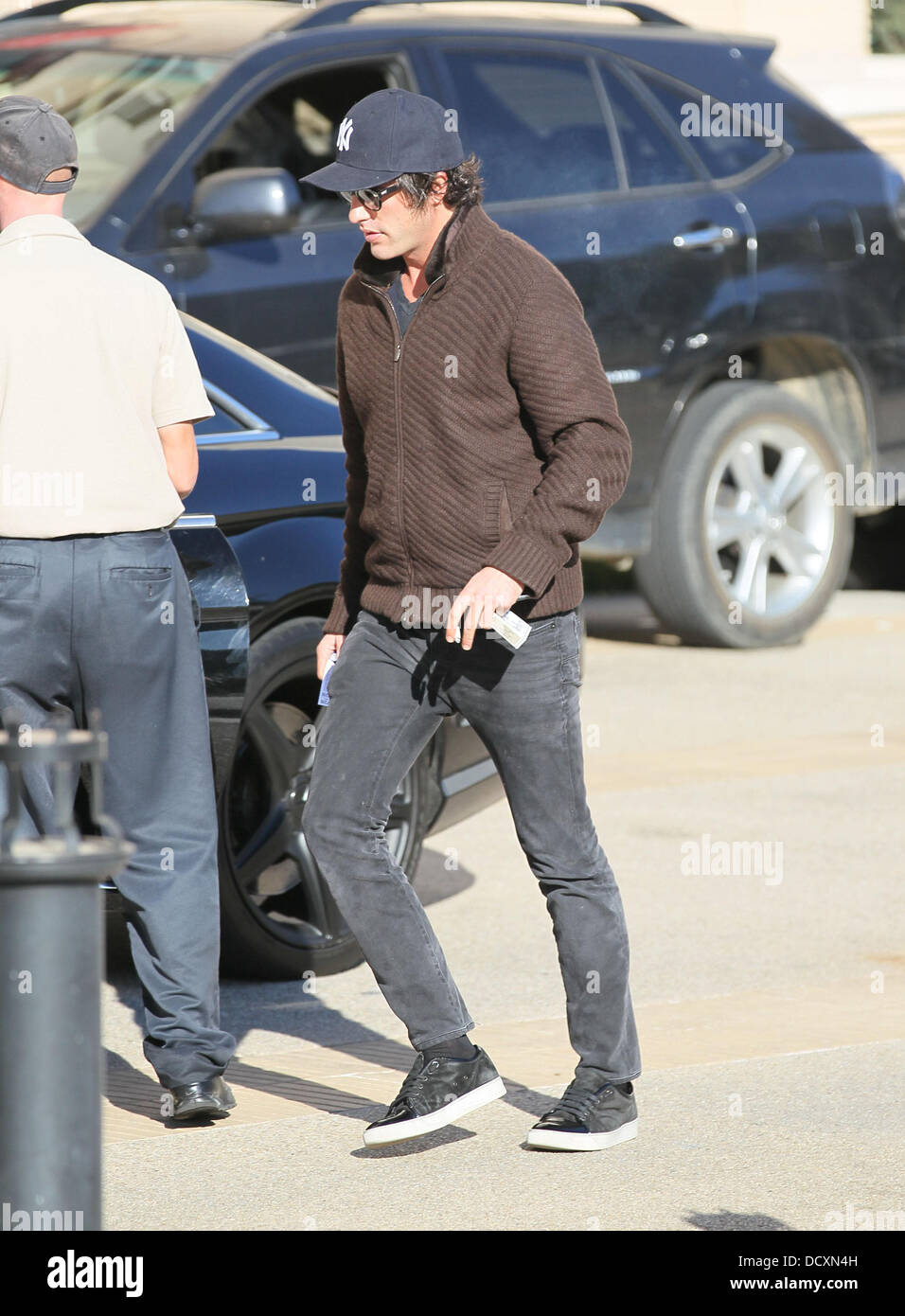 Brandon Davis smoking a cigarette as he shops at Barney's of New York ...