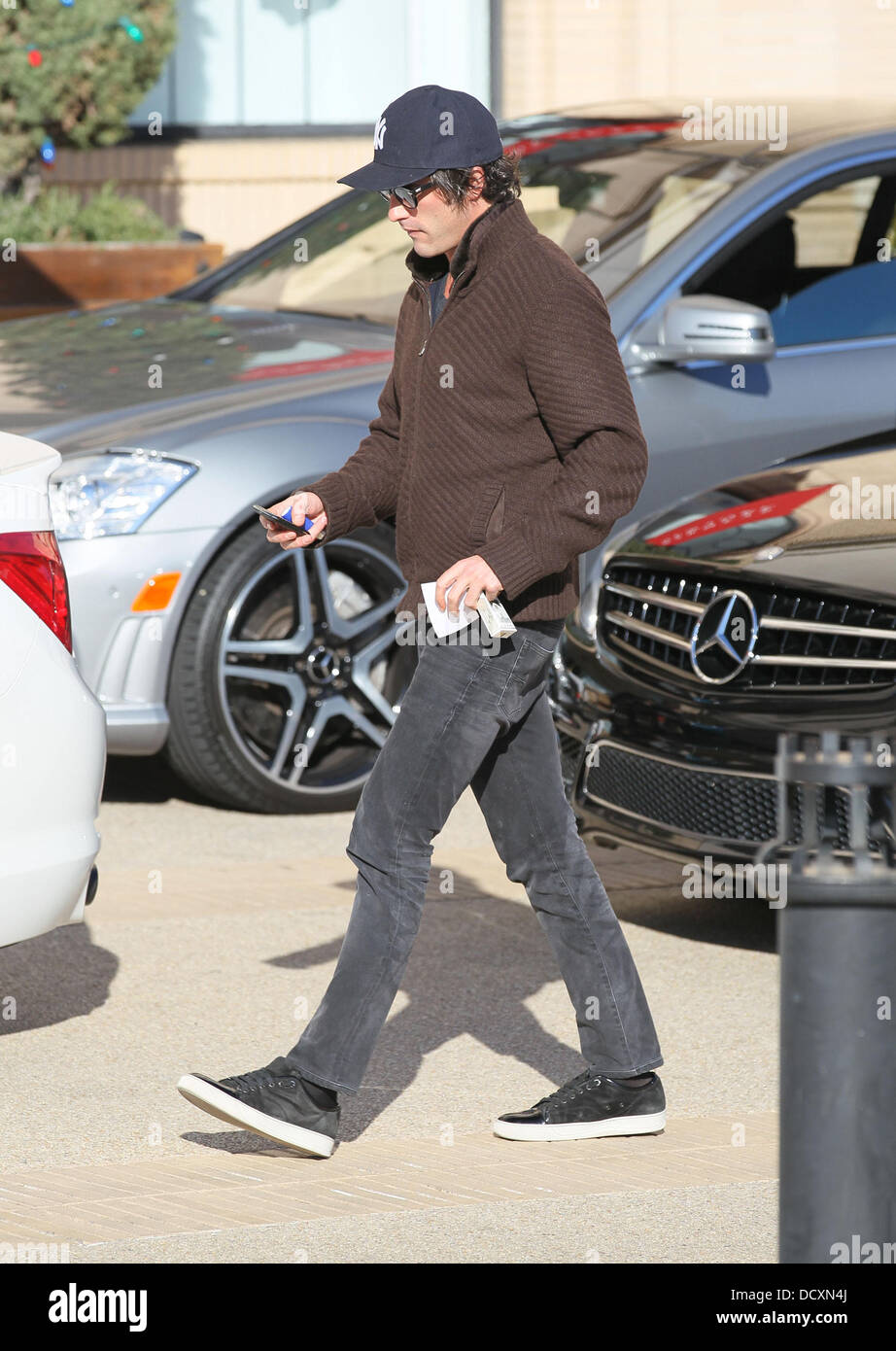 Brandon Davis smoking a cigarette as he shops at Barney's of New York ...