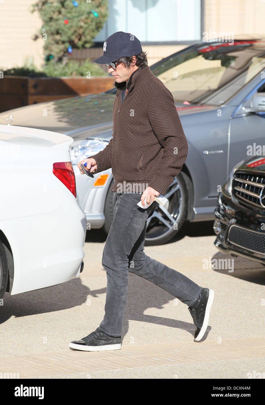 Brandon Davis smoking a cigarette as he shops at Barney's of New York ...