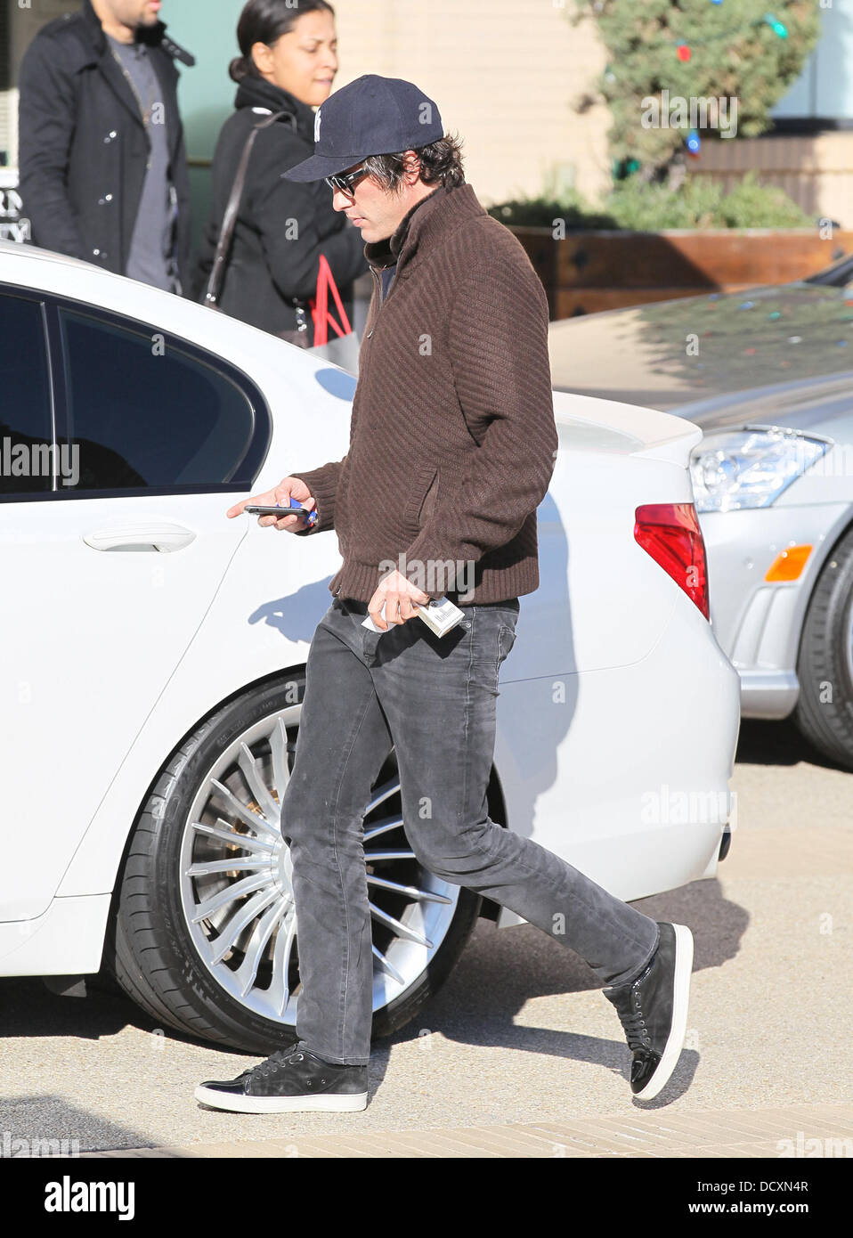 Brandon Davis smoking a cigarette as he shops at Barney's of New York ...