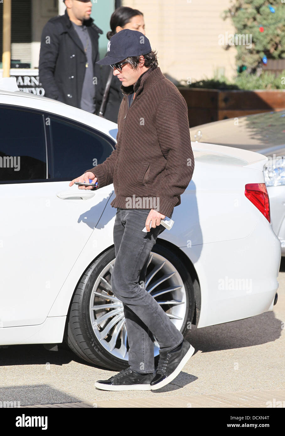 Brandon Davis smoking a cigarette as he shops at Barney's of New York ...