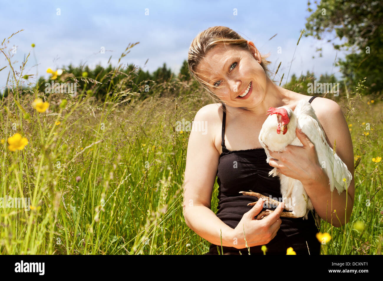 Woman holding pet chicken hen hi-res stock photography and images - Alamy