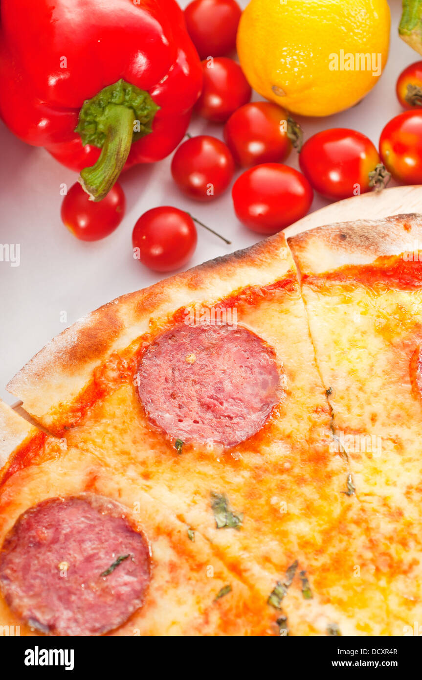 Italian original thin crust pepperoni pizza Stock Photo - Alamy