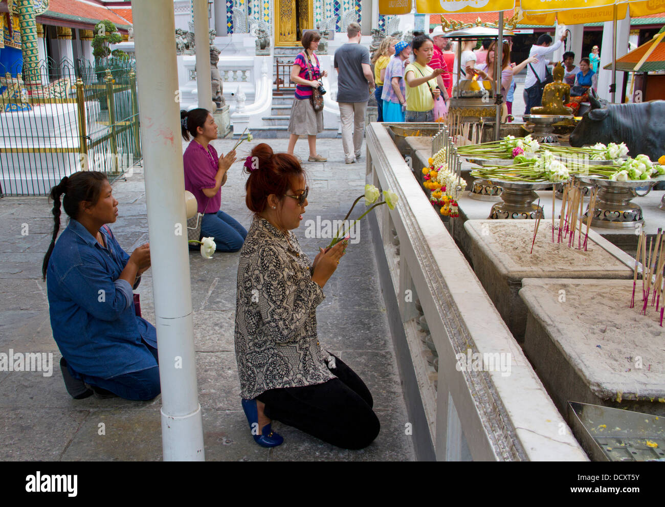 Buddhists pray in the Grand Palace complex, in the heart of Bangkok ...
