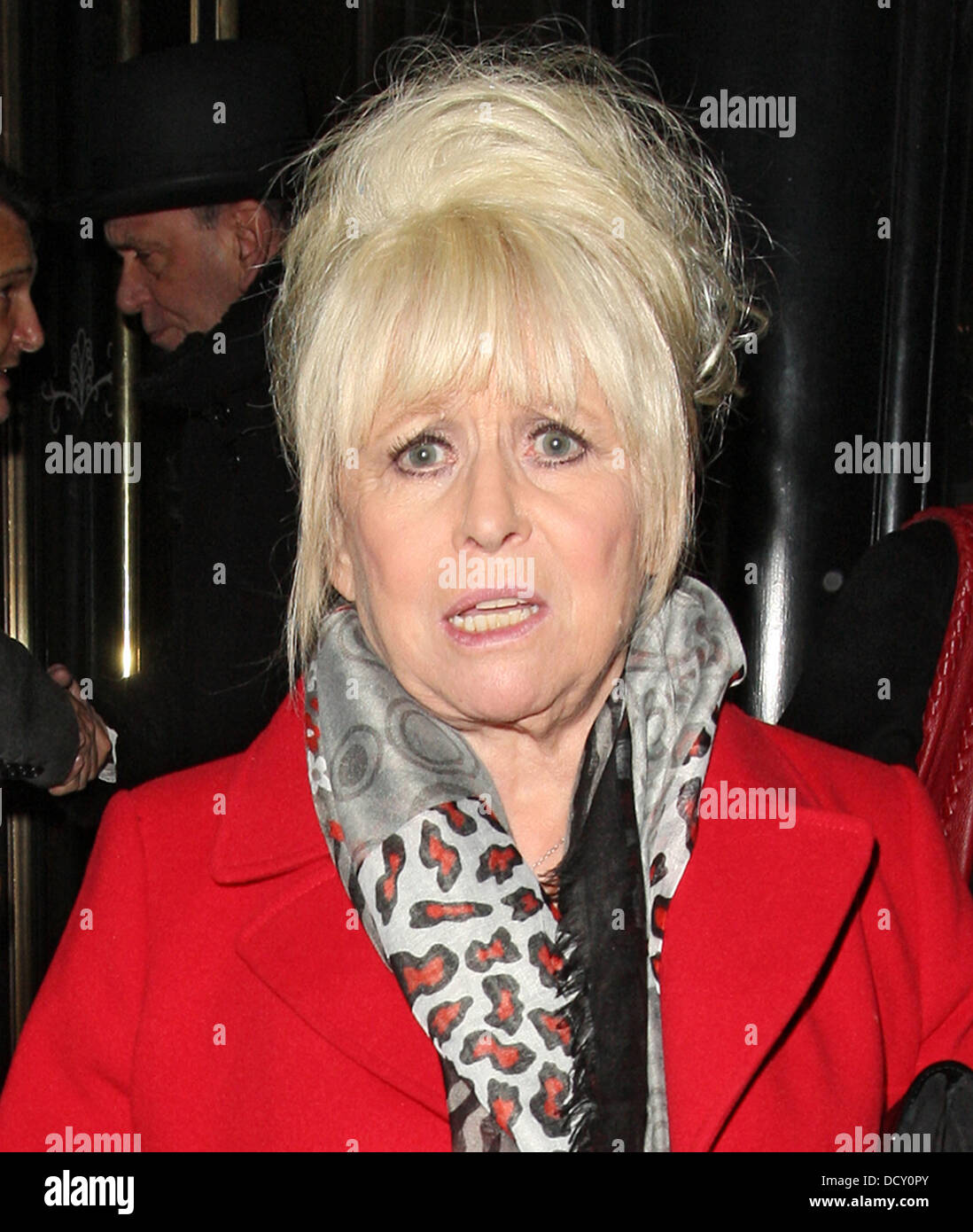 Barbara Windsor wearing a scarlet red coat leaves the Wolseley ...