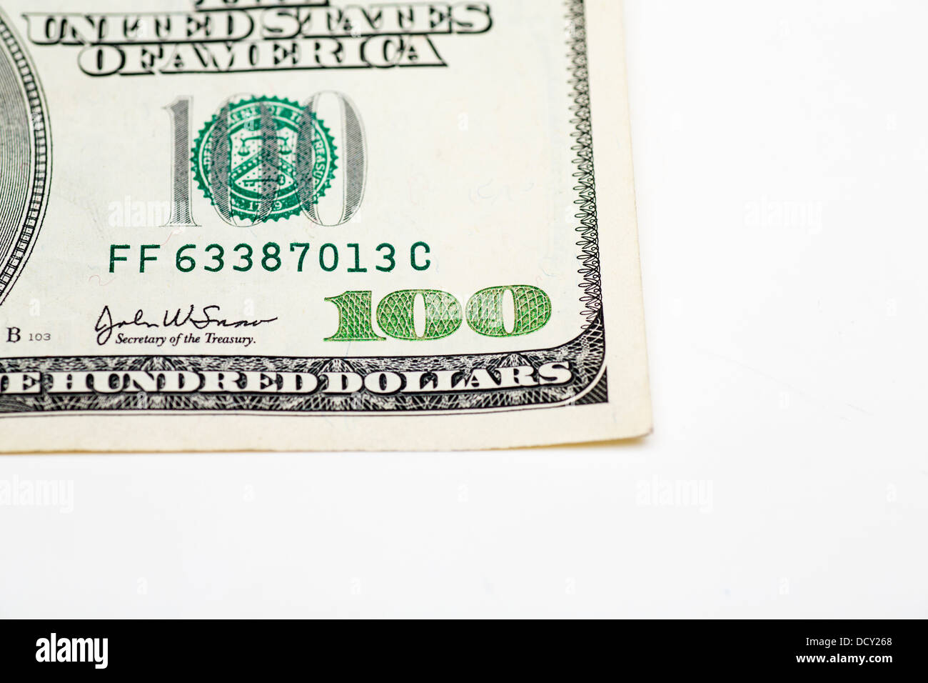 Corner of a hundred dollar bill on a white background Stock Photo - Alamy