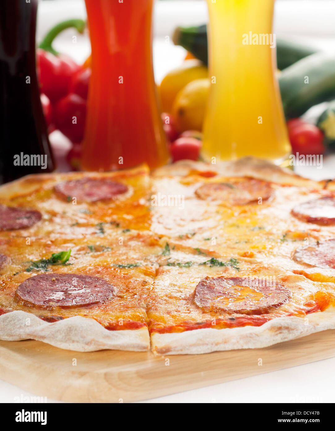 Italian original thin crust pepperoni pizza Stock Photo - Alamy