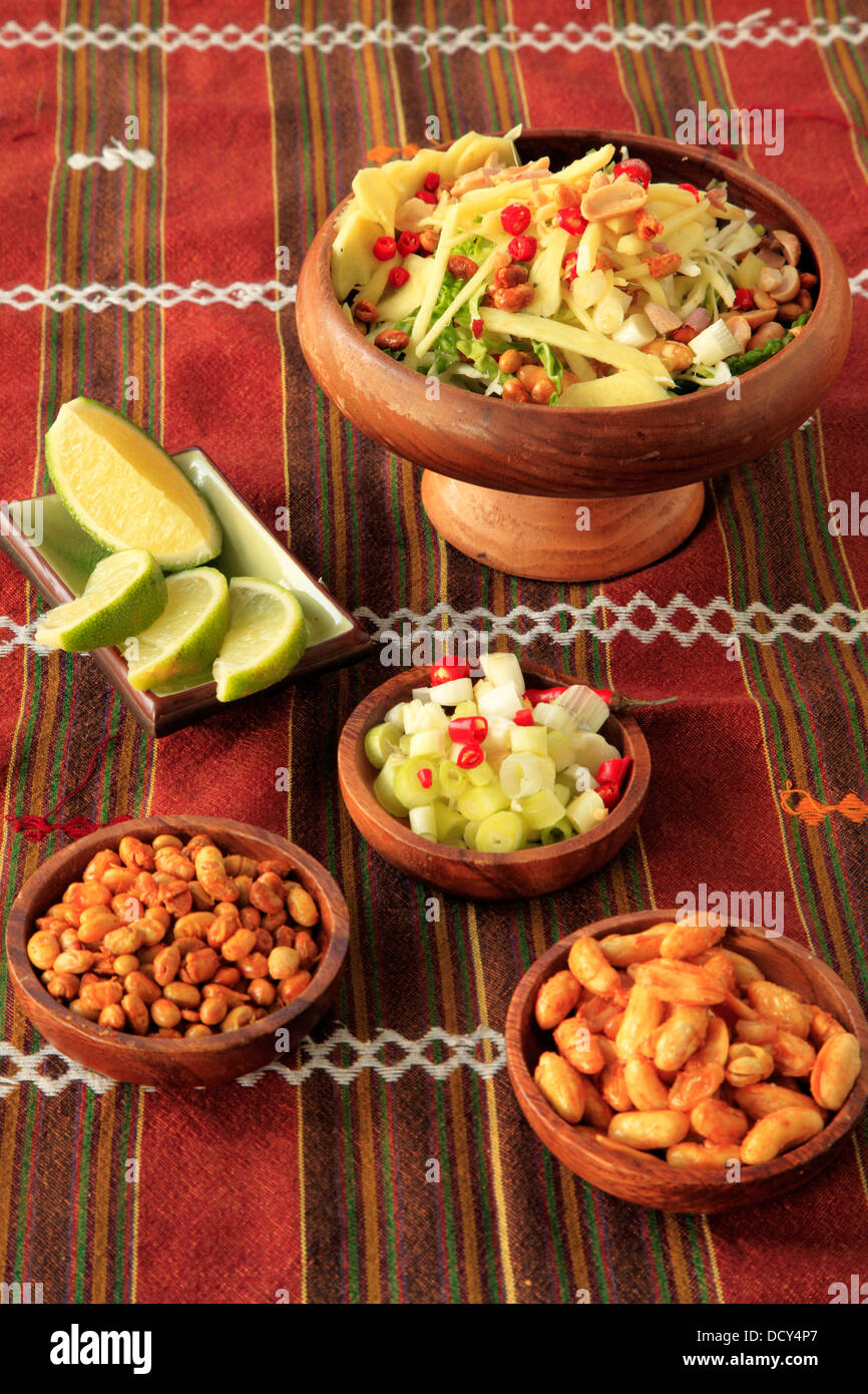 Burmese ginger salad with side dishes Stock Photo - Alamy