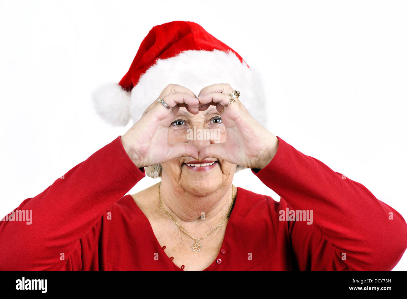 Grandma making heart symbol Stock Photo - Alamy
