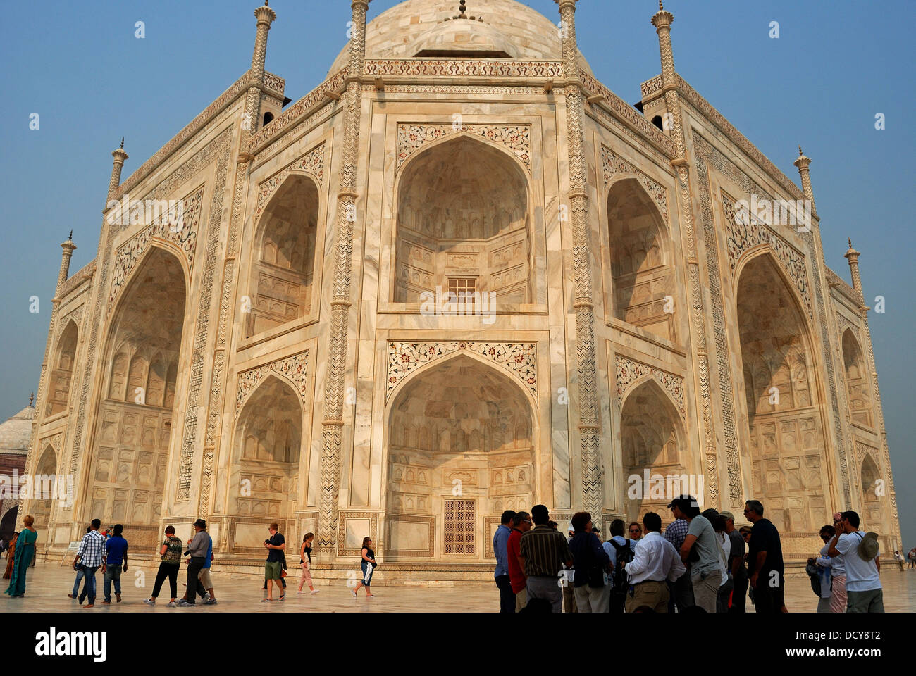 tourist enjoying the beauty of taj mahal,india. This marble ...