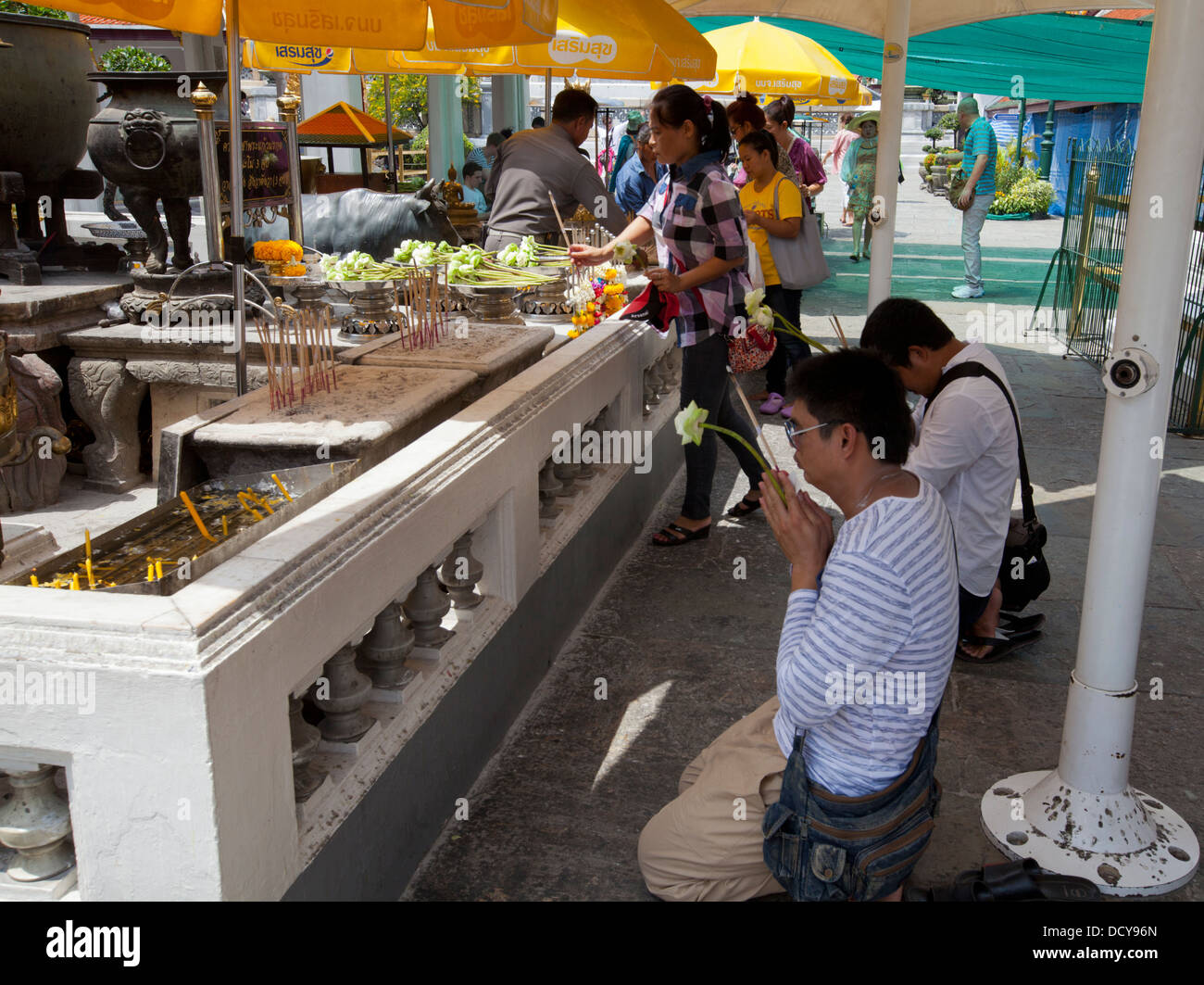 Buddhists pray in the Grand Palace complex, in the heart of Bangkok ...