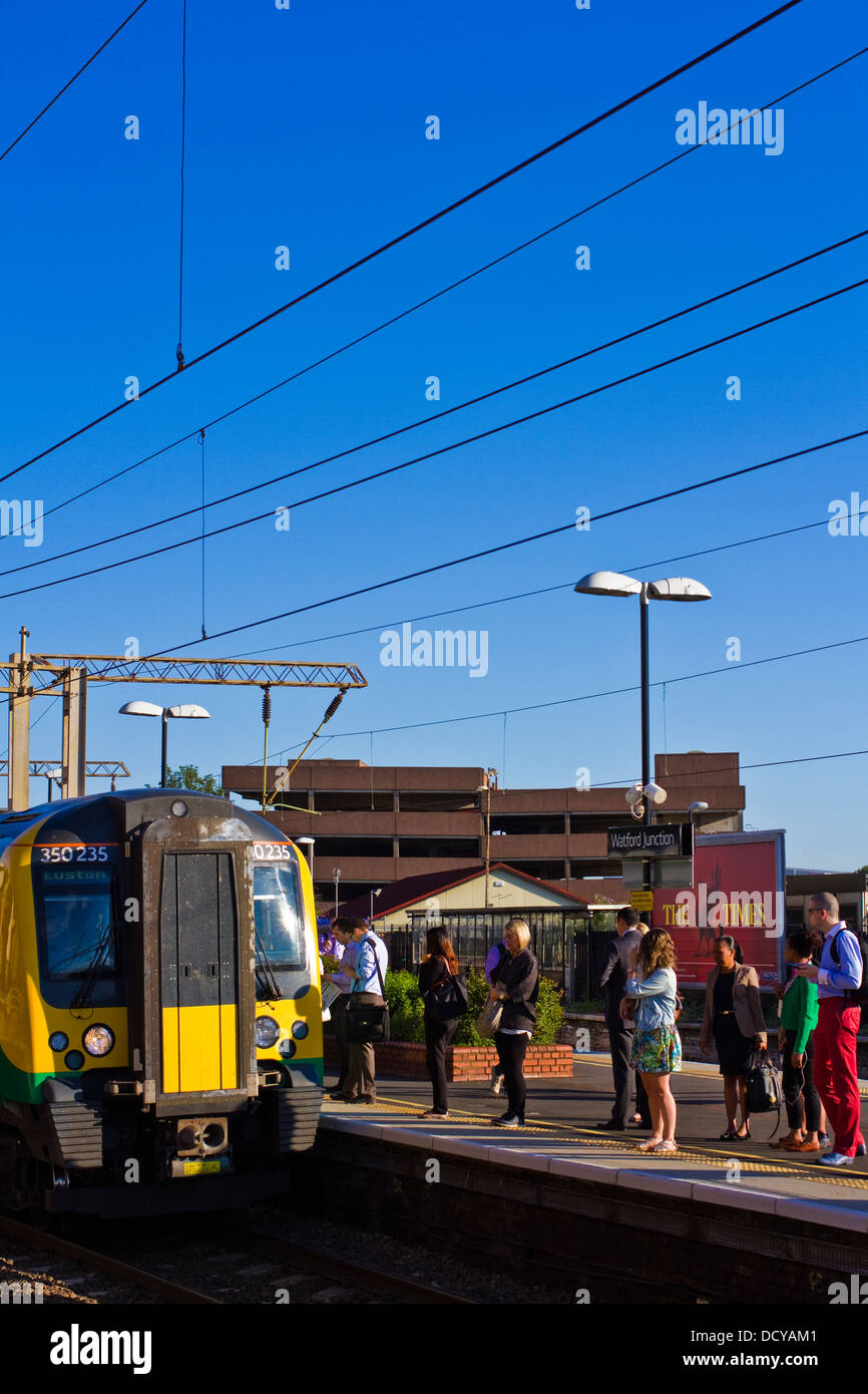 Passengers on platform waiting for train at Watford Junction railway ...