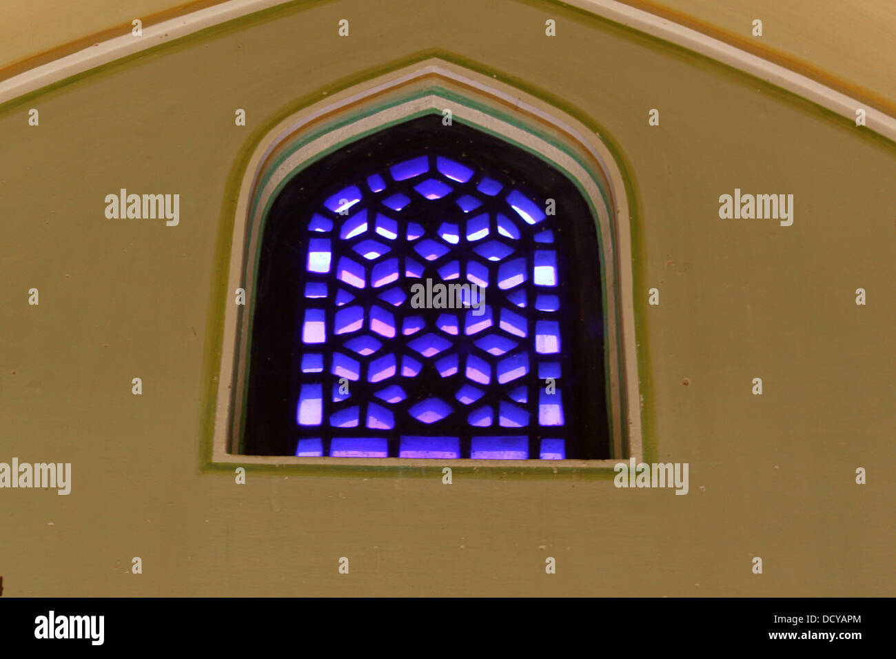 Blue tinted Italian glass work on a small window Jaipur Rajasthan India ...