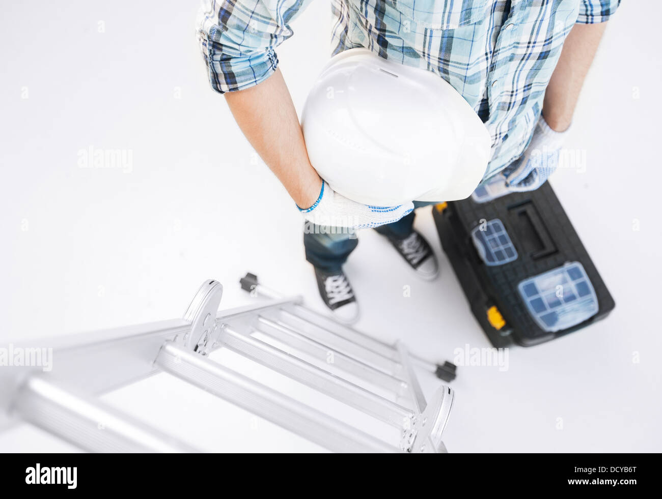 man with ladder, helmet and toolkit Stock Photo - Alamy