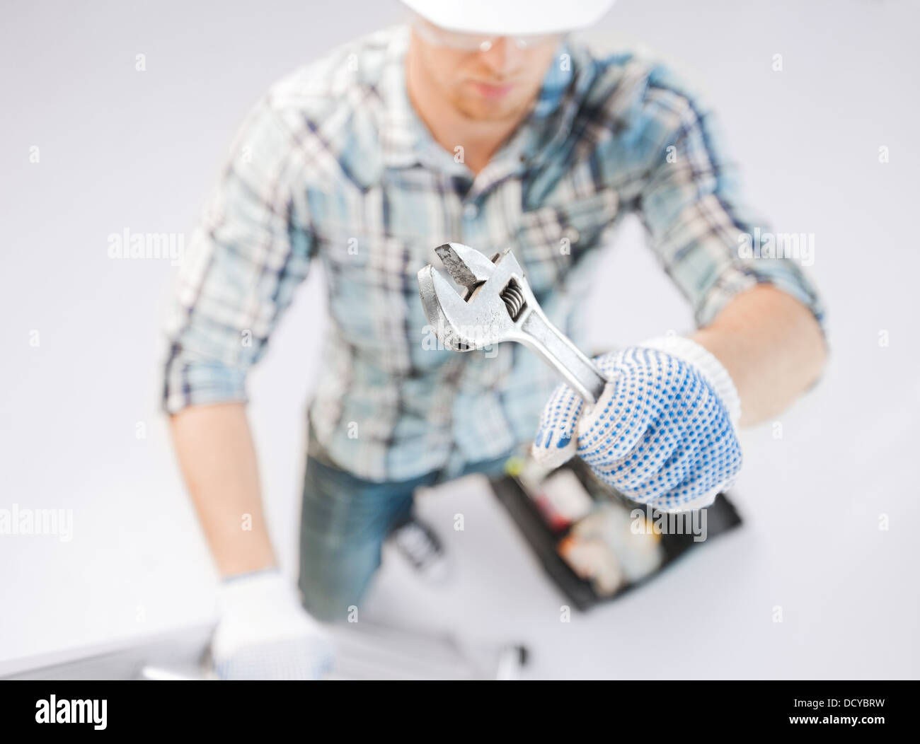 man with ladder, toolkit and spanner Stock Photo - Alamy