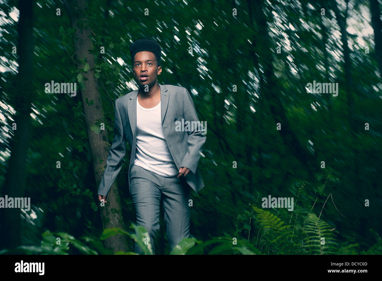 young black male running through woods Stock Photo - Alamy