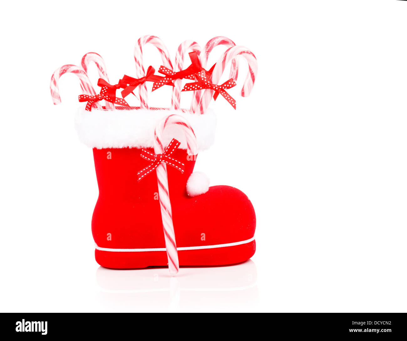 Christmas candy sticks in a red shoe Stock Photo - Alamy