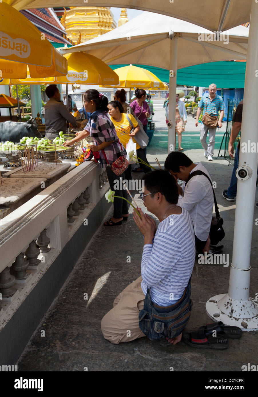 Buddhists pray in the Grand Palace complex, in the heart of Bangkok ...