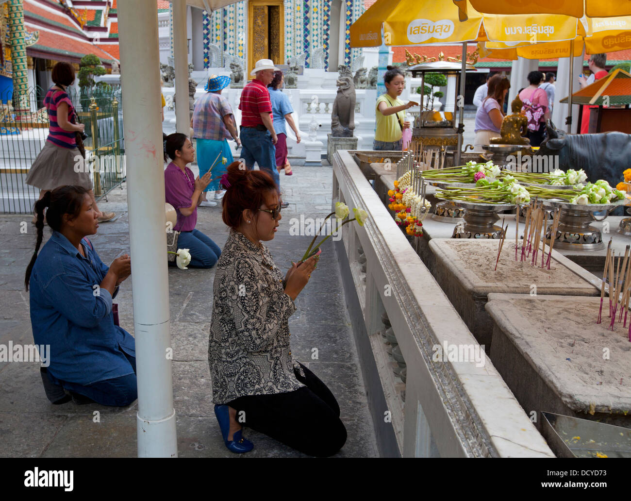 People pray in the Grand Palace complex, in the heart of Bangkok ...