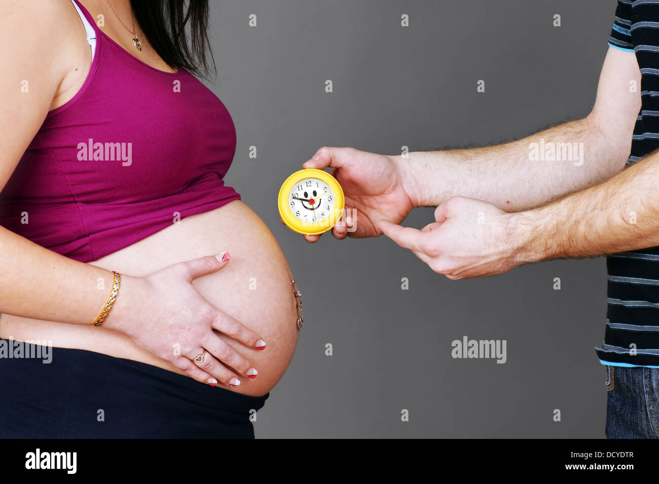 Dad showing time to baby Stock Photo - Alamy