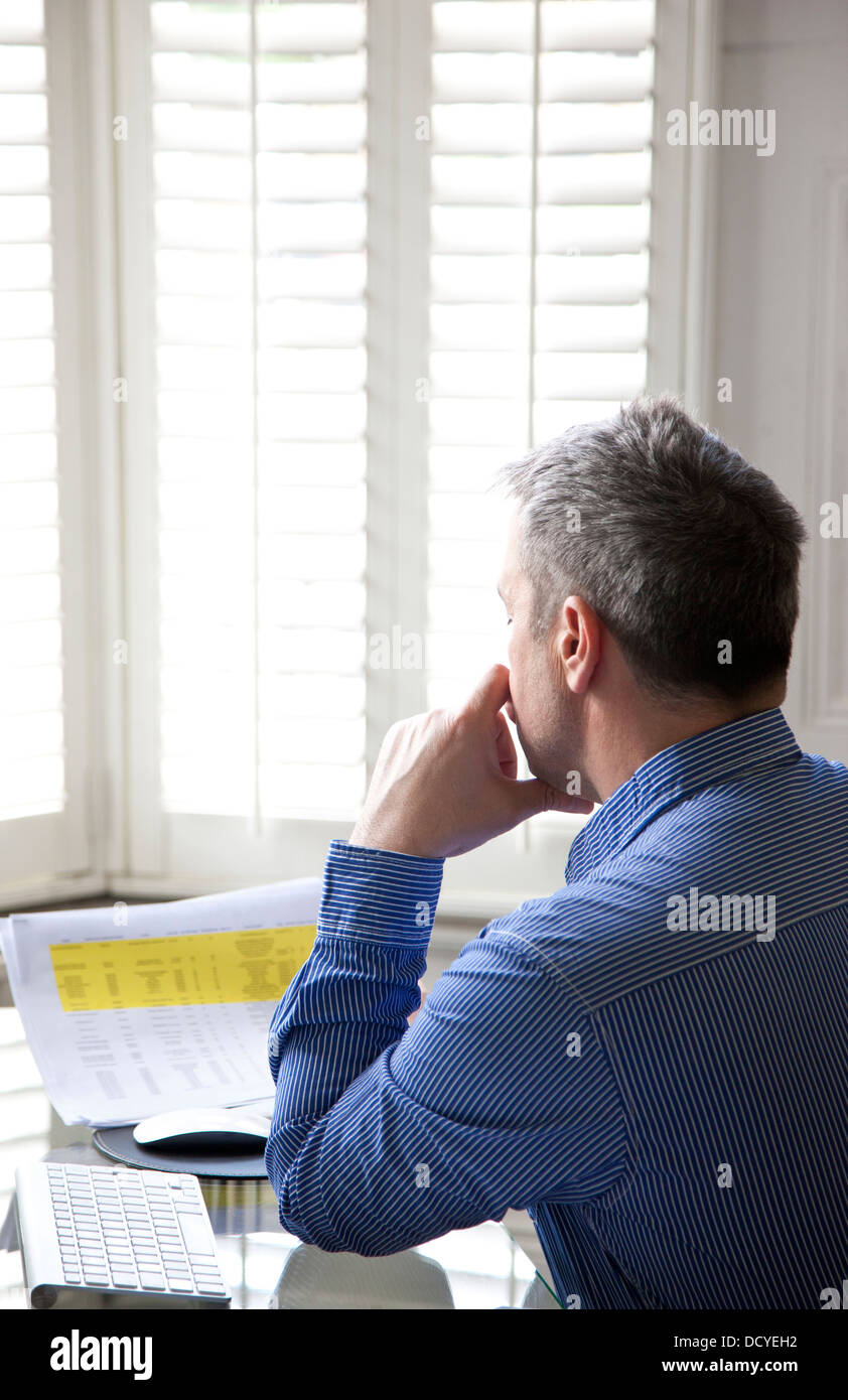 Man desk looking out window hi-res stock photography and images - Alamy