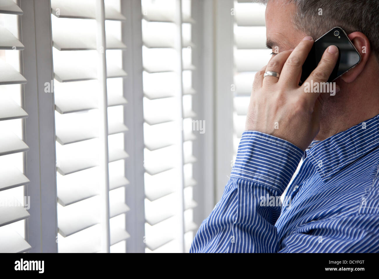 Close up Profile of Man Using Cell Phone Stock Photo - Alamy
