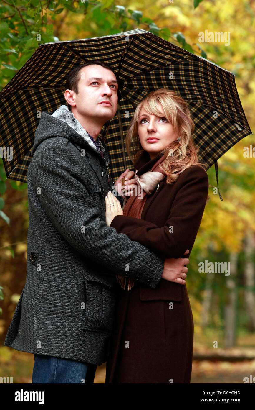 Couple in autumn park Stock Photo - Alamy