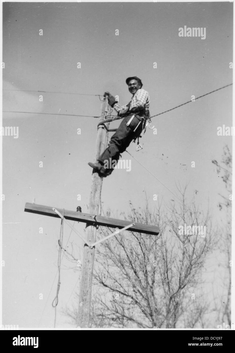 Electrical workers labor on a utility pole hi-res stock photography and ...