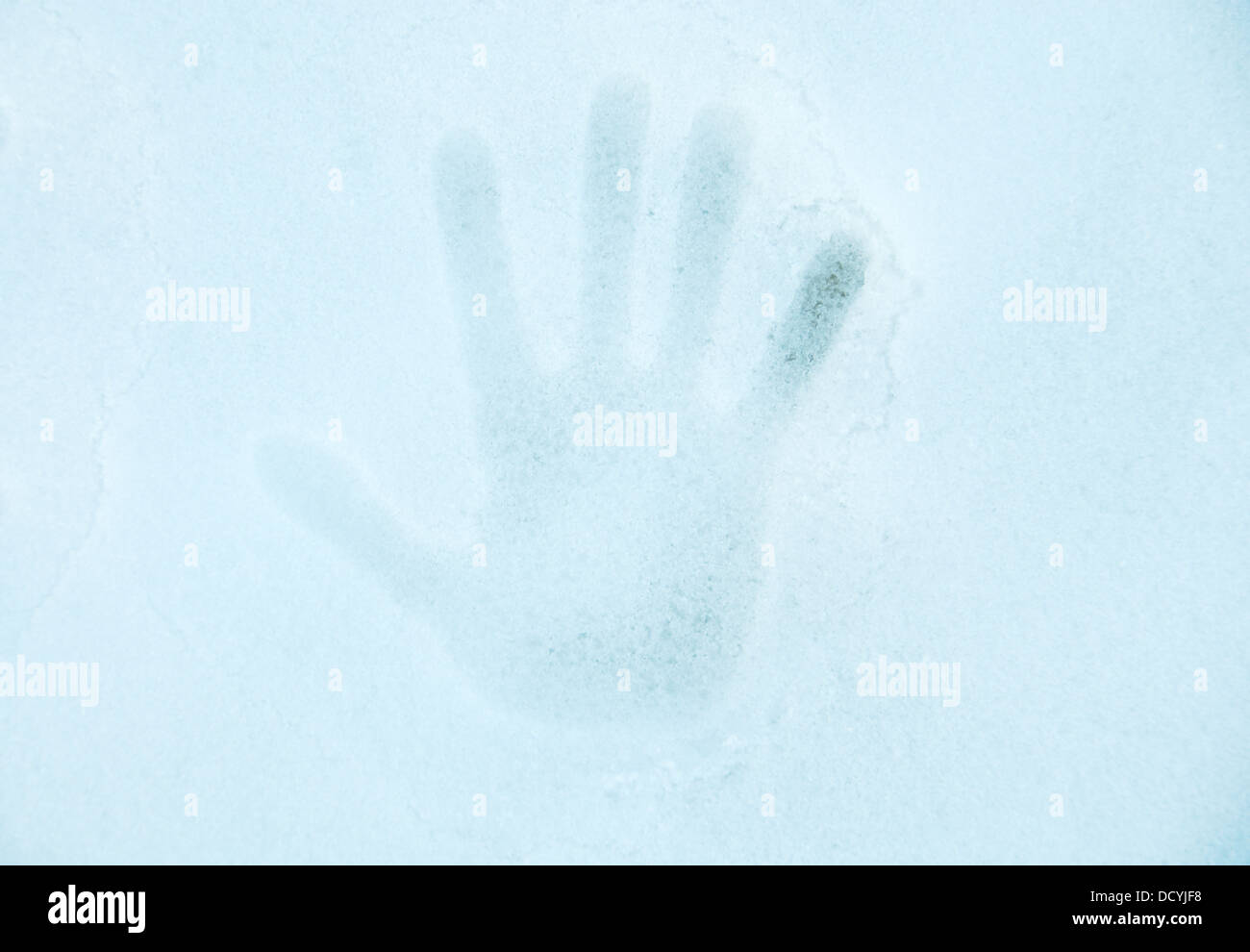 Hand print on a snow Stock Photo - Alamy