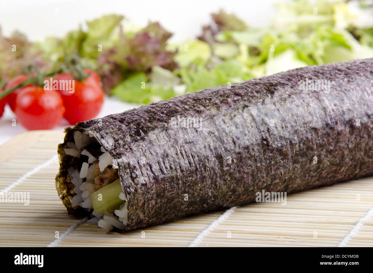 sushi roll before it is cut into portions Stock Photo - Alamy