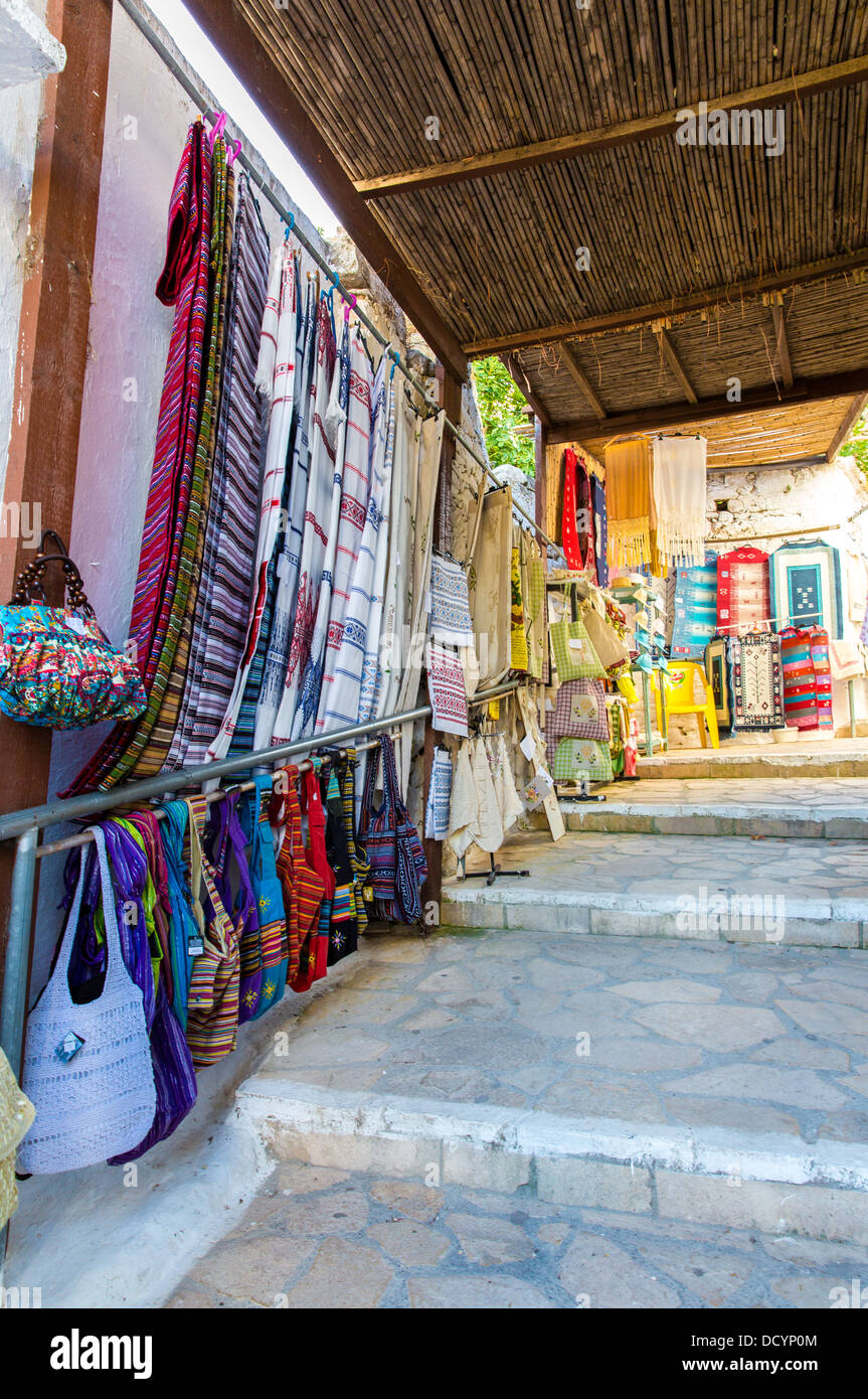Traditional textiles on a market stall, colorful fabric, handmade ...