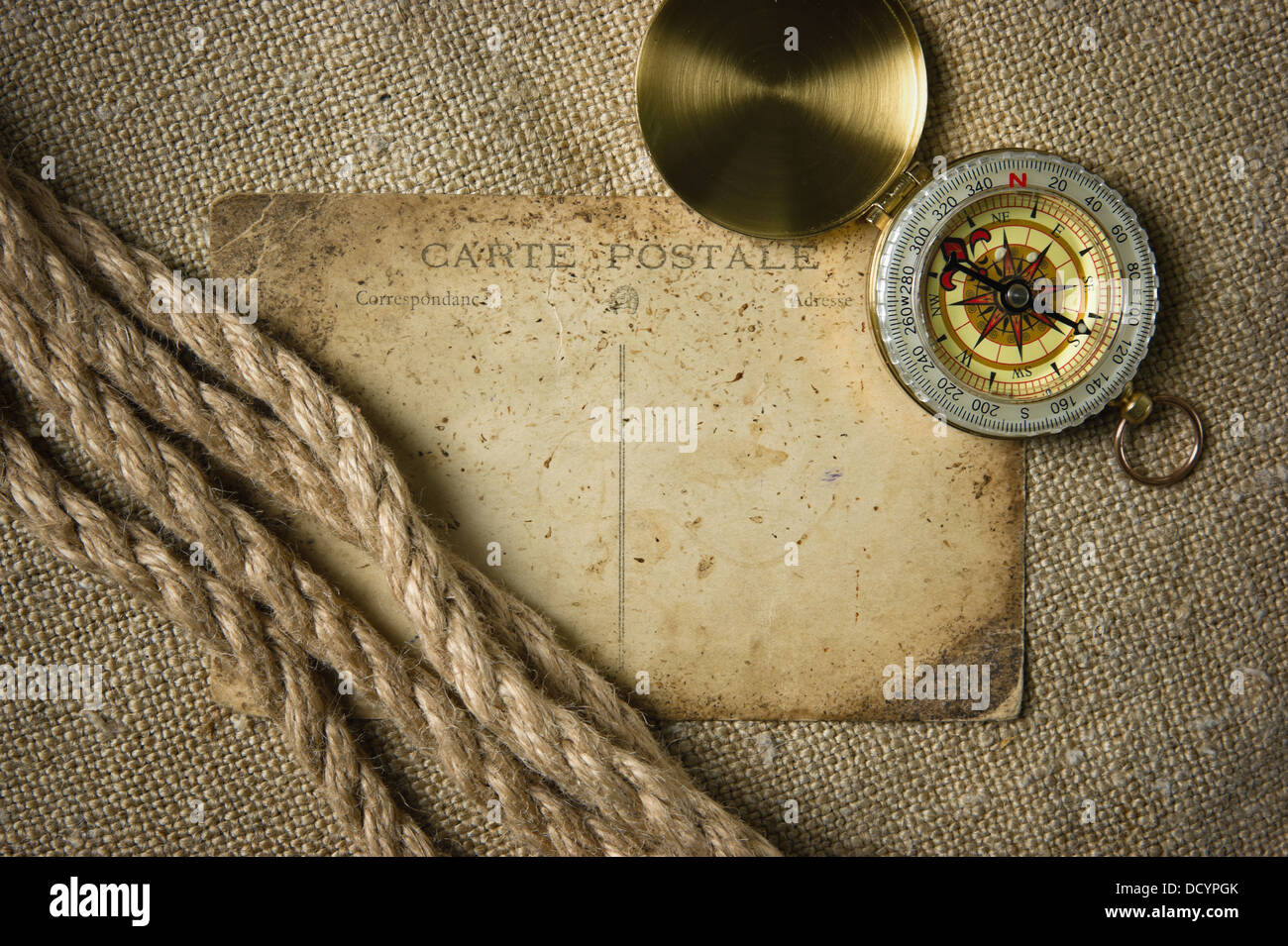 Vintage background with old paper and compass Stock Photo - Alamy