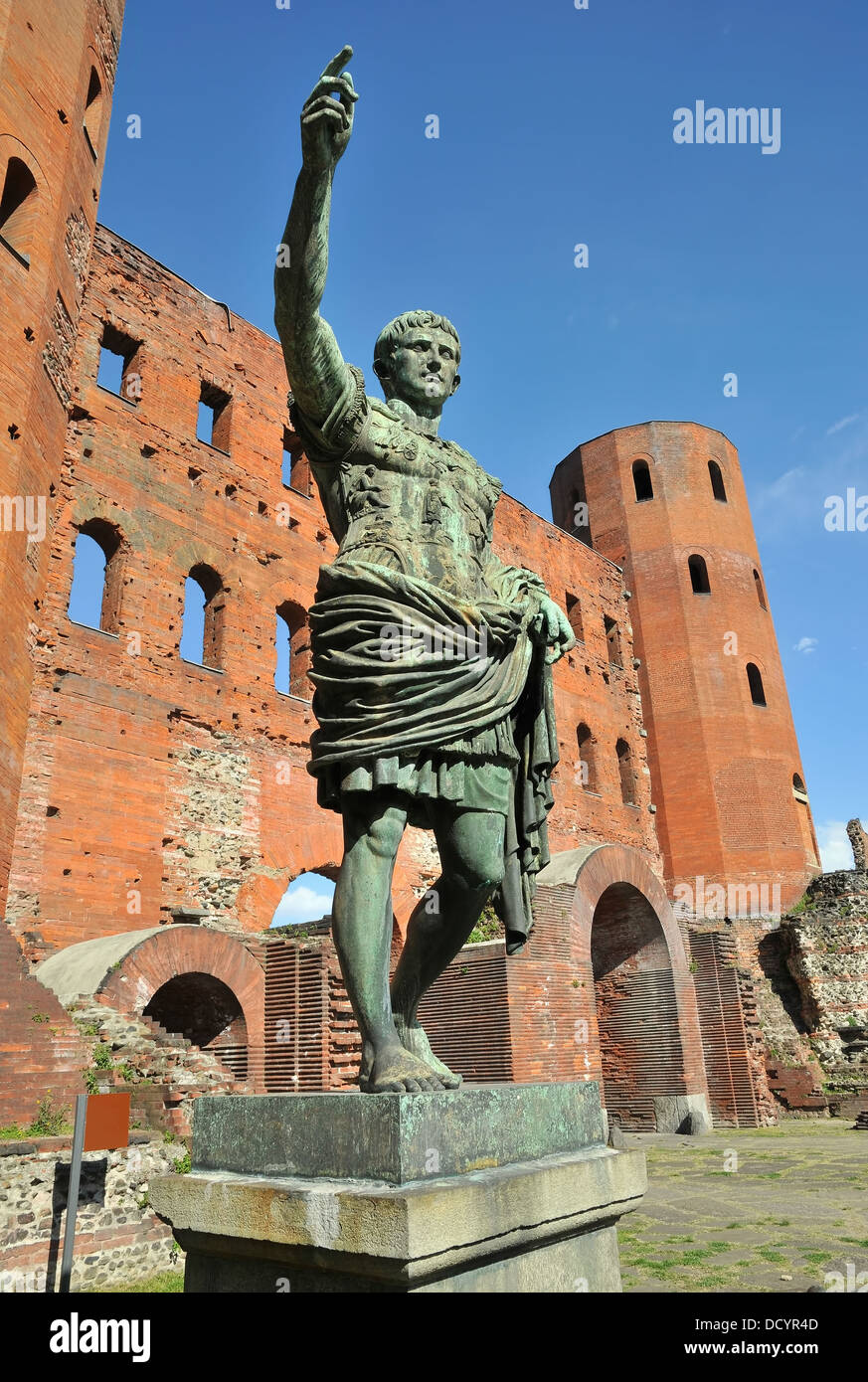 statue of roman imperor on front of porta palatina in turin in clear ...