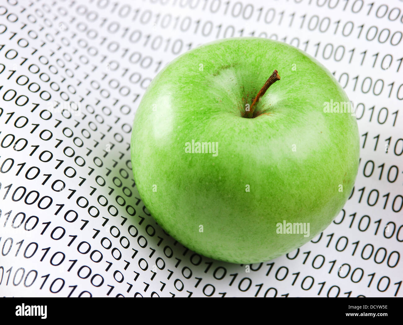 green apple on a binary code Stock Photo - Alamy