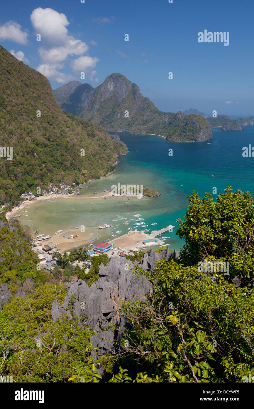 Aerial View Of Limestone Spires Over Coastal Village; El Nido, Palawan ...