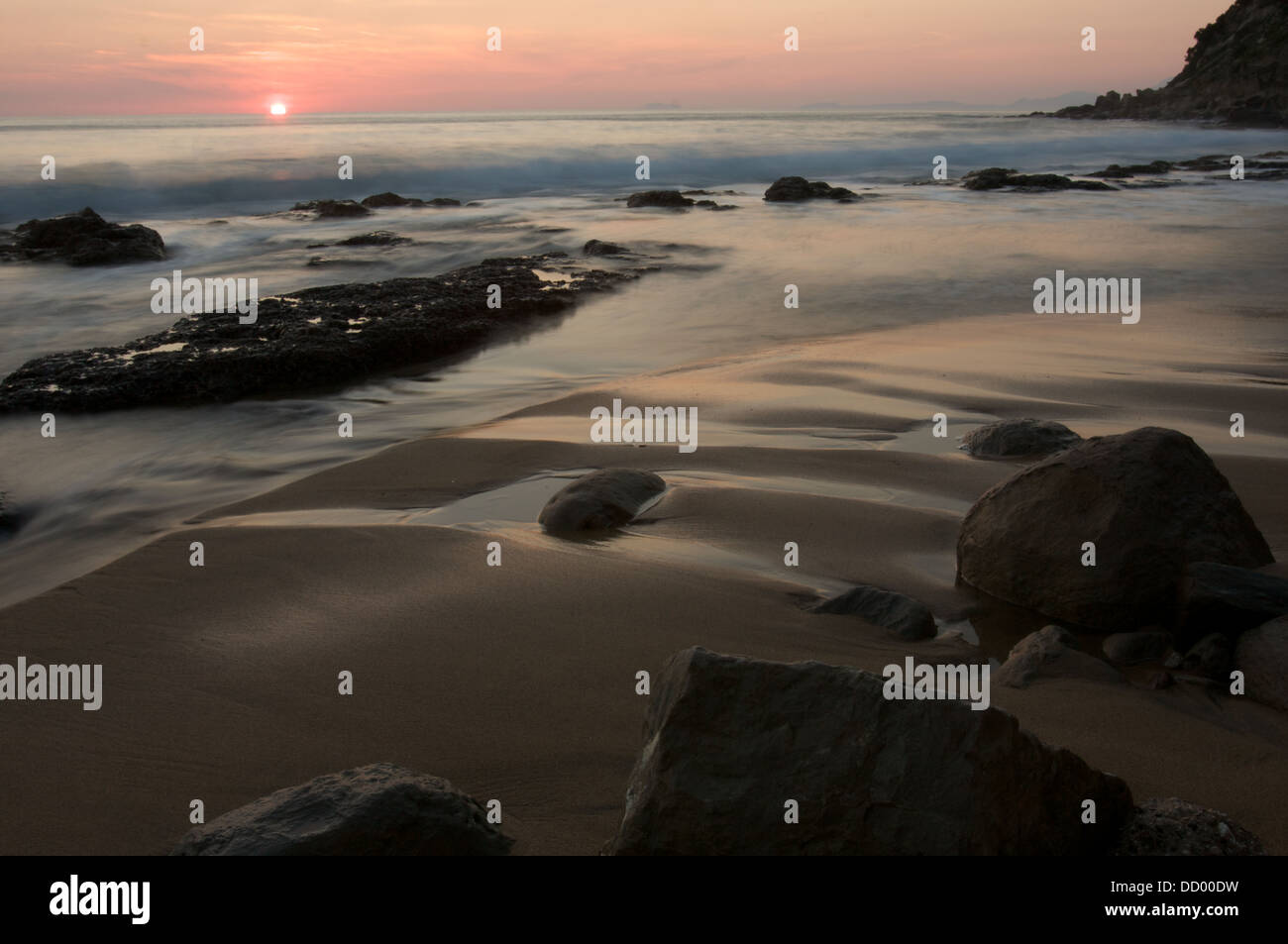 Italian beach at sunset, with motion blur of waves Stock Photo - Alamy
