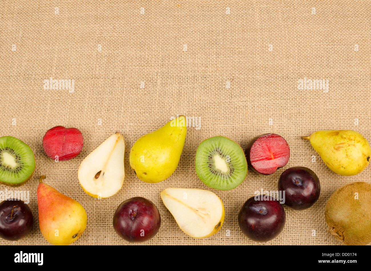Assorted fresh fruit arranged in a background Stock Photo - Alamy