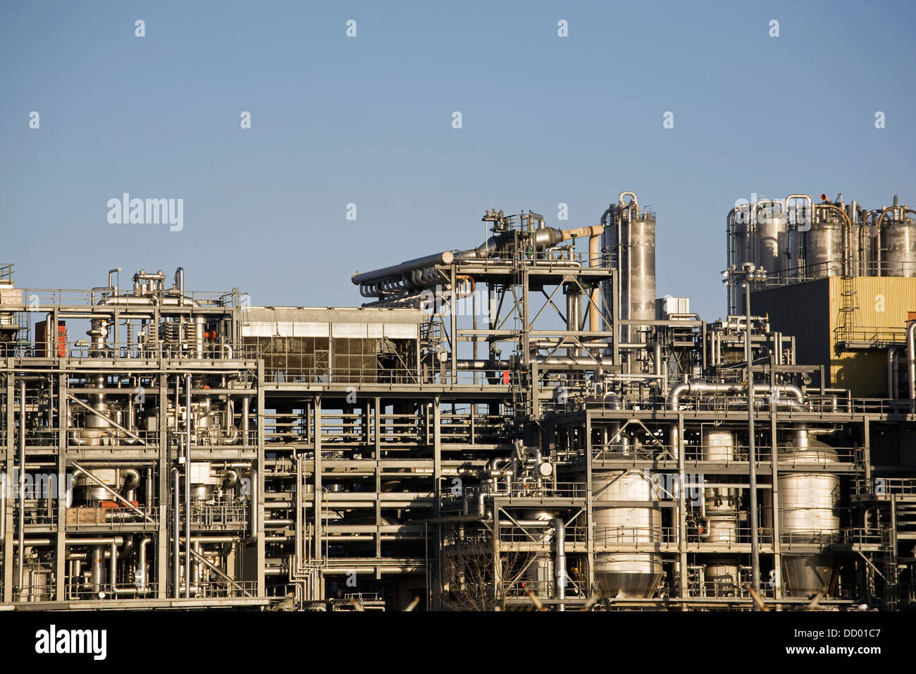 Refinery Pipes Against A Blue Sky; Fort Saskatchewan, Alberta, Canada ...