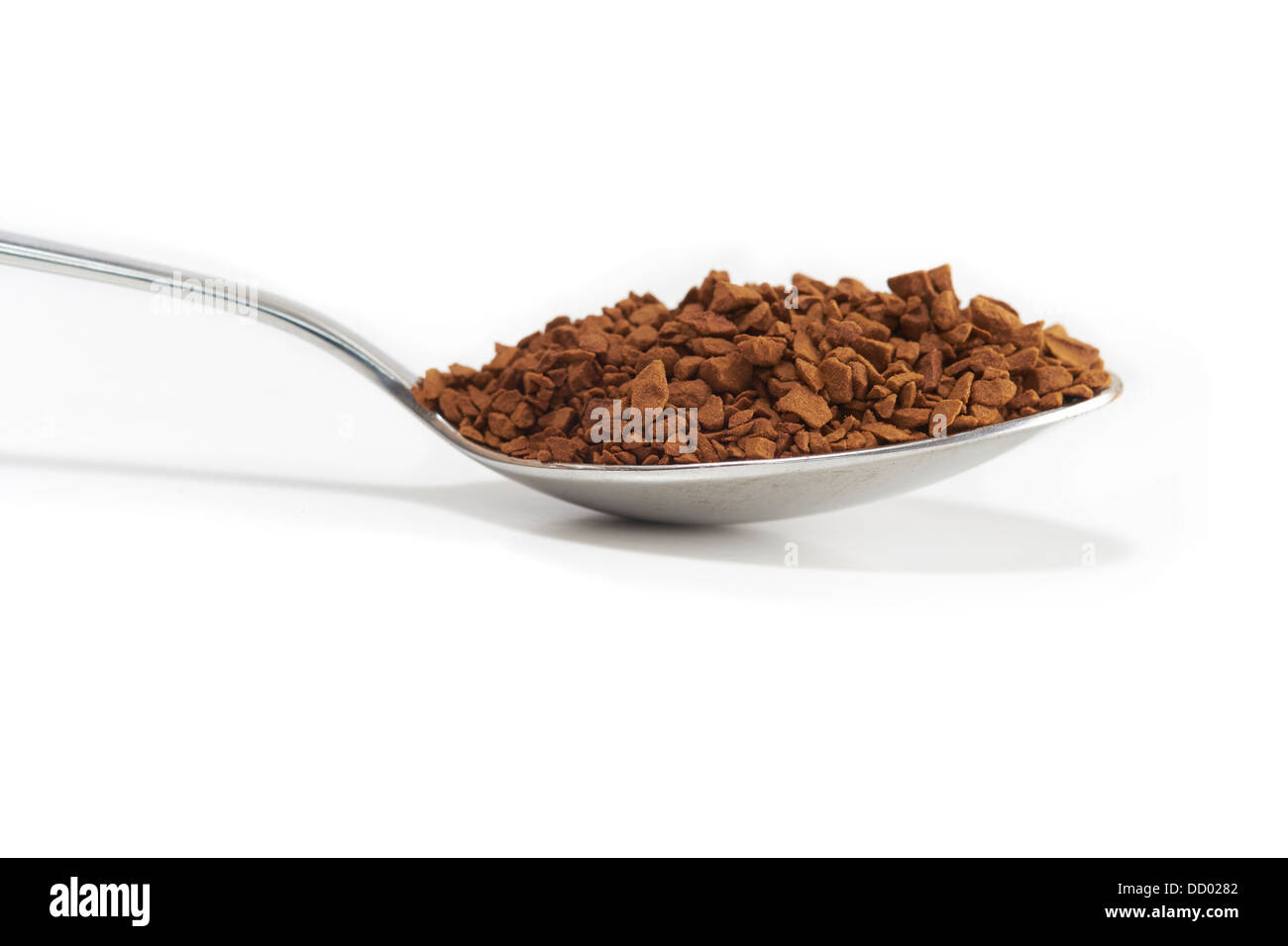Spoon of coffee on a white background Stock Photo - Alamy