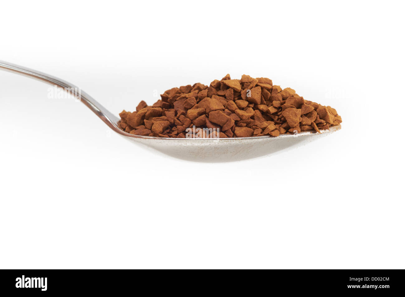 Spoon of coffee on a white background Stock Photo - Alamy