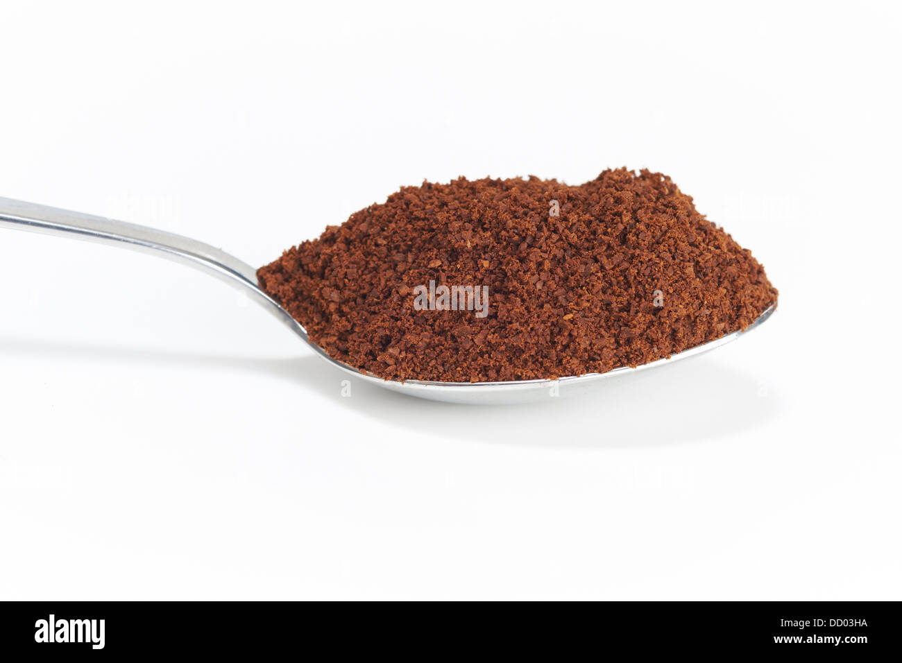 Spoon of coffee on a white background Stock Photo - Alamy