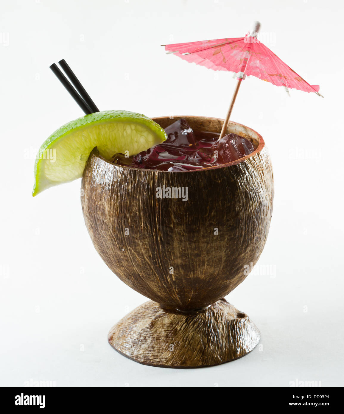 refreshing summer drink served in a coconut shell garnished with a lime ...