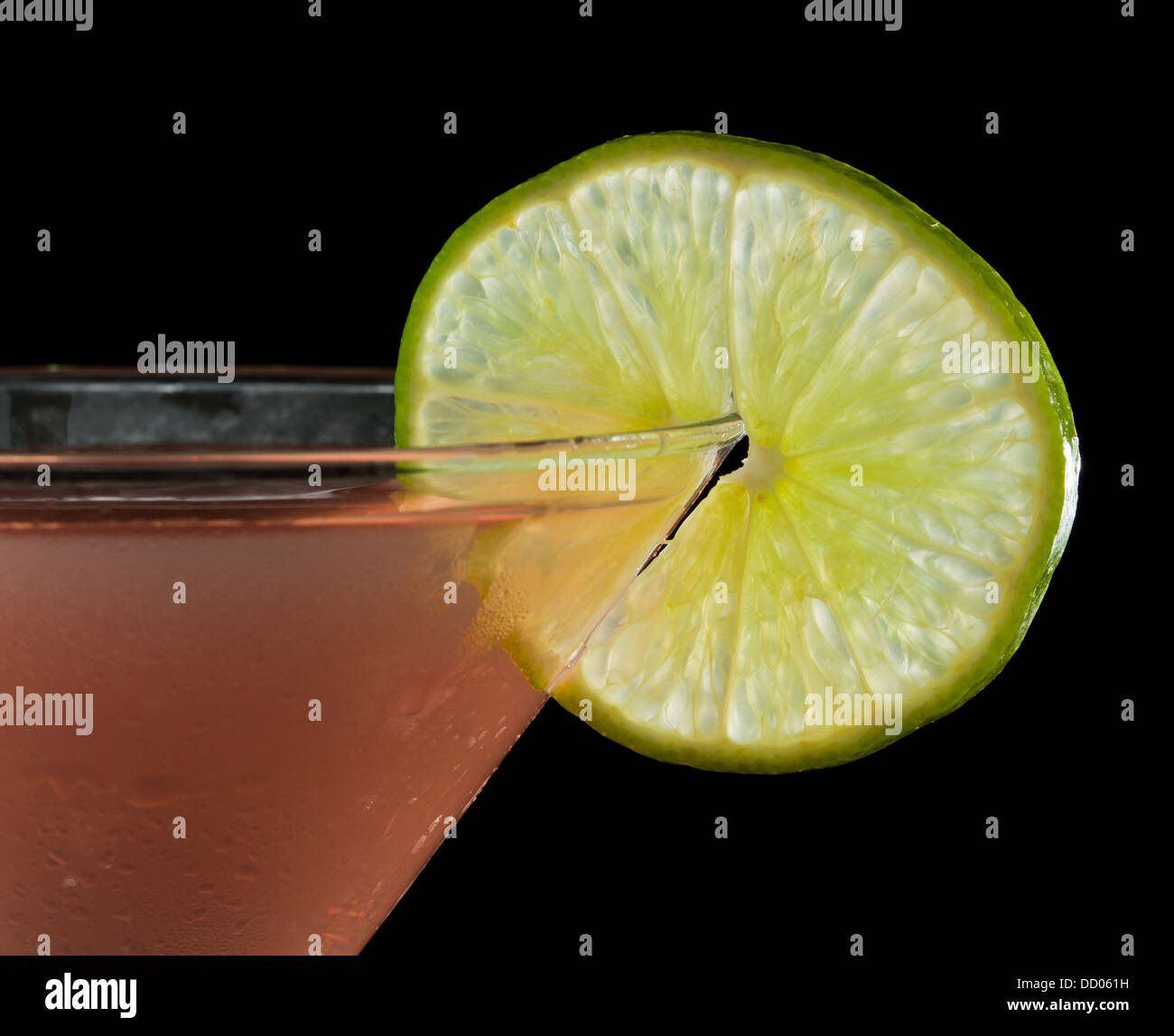 lime wheel on the rim of a martini glass used as a garnish isolated on ...