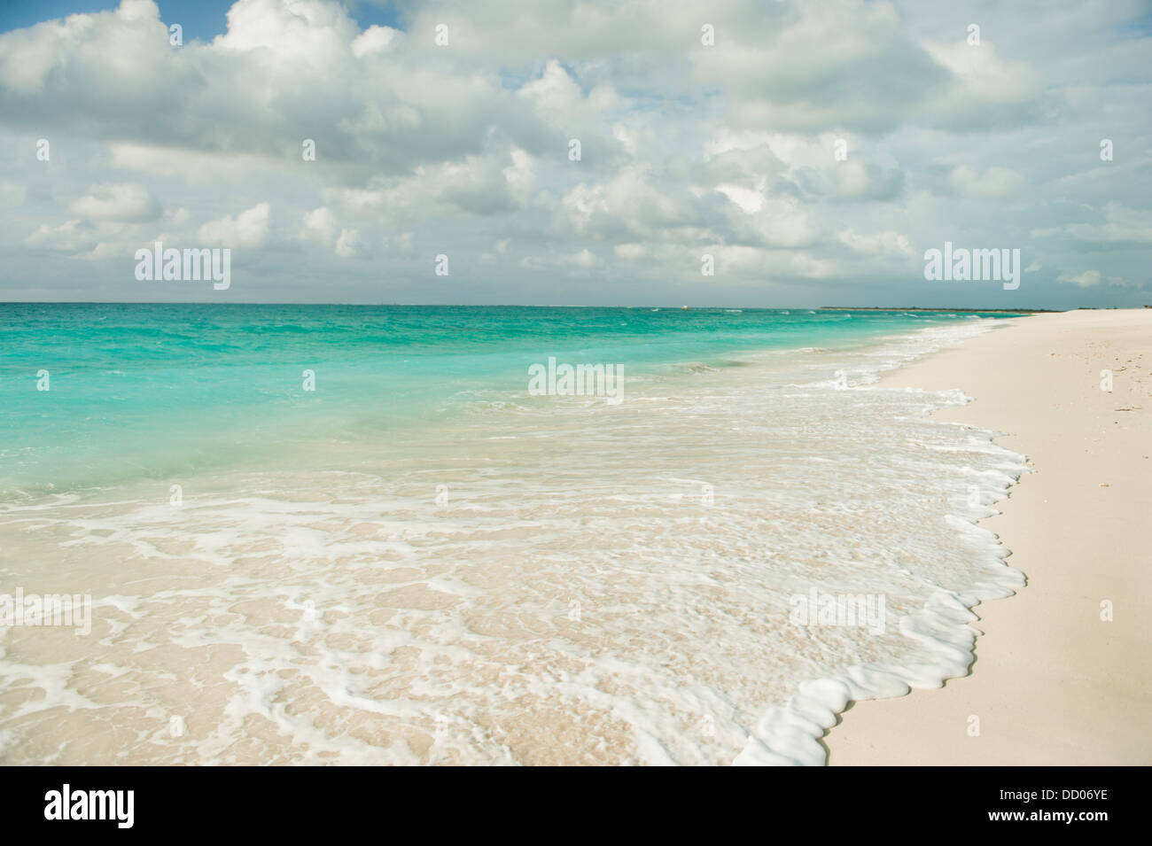 Water Washing Up Onto The Sandy Beach; Providenciales Turks And Caicos ...