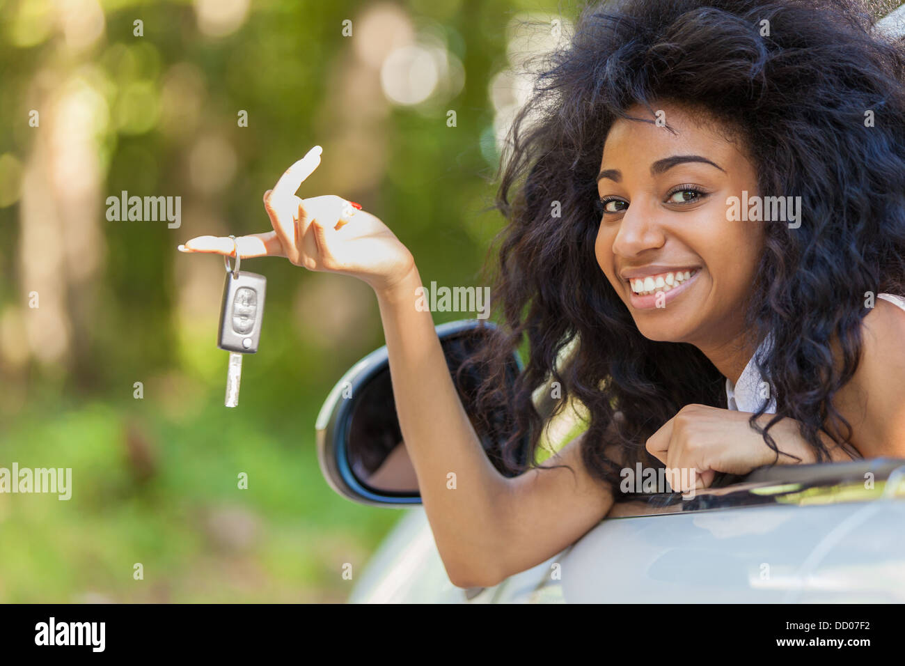 Young black woman driving hi-res stock photography and images - Alamy