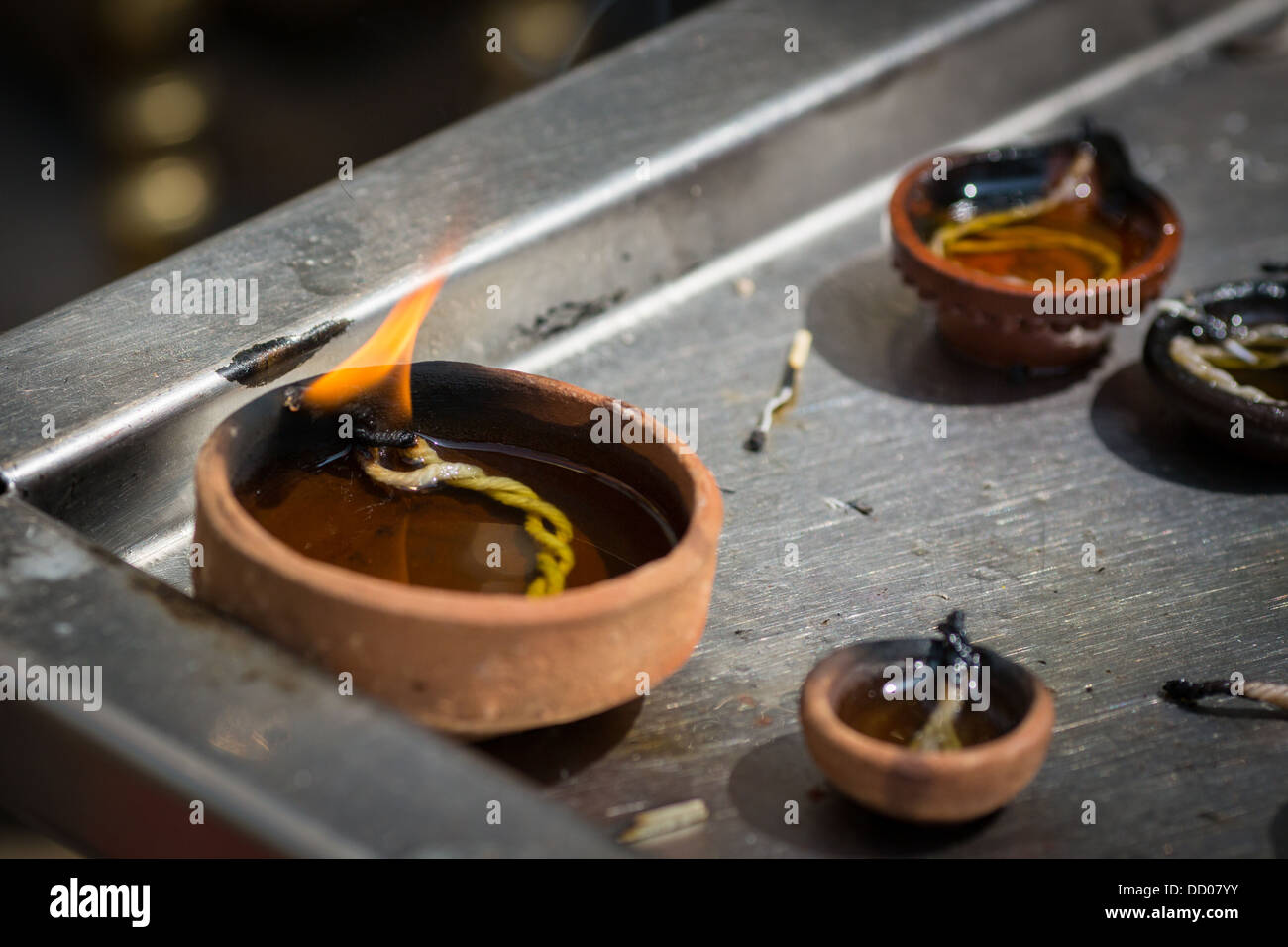 Oil lamps in hindu temple hi-res stock photography and images - Alamy