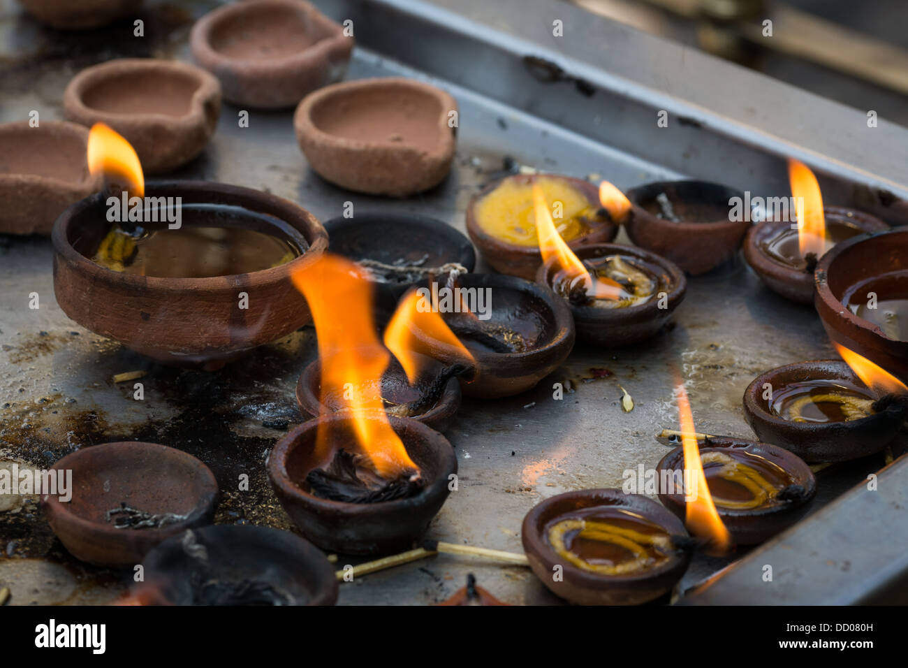 Oil lamps in hindu temple hi-res stock photography and images - Alamy