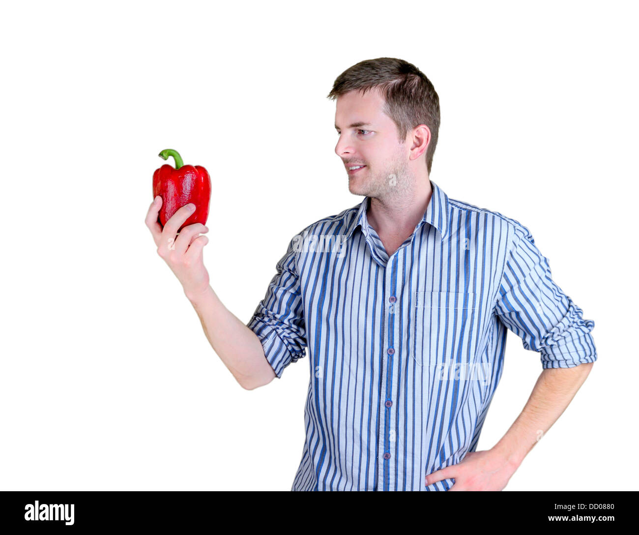 Man holding a big red bell pepper Stock Photo - Alamy