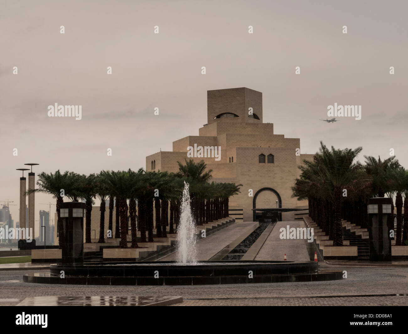 Fountain and tree lined walkway of Museum of Islamic Art in Doha, Qatar ...